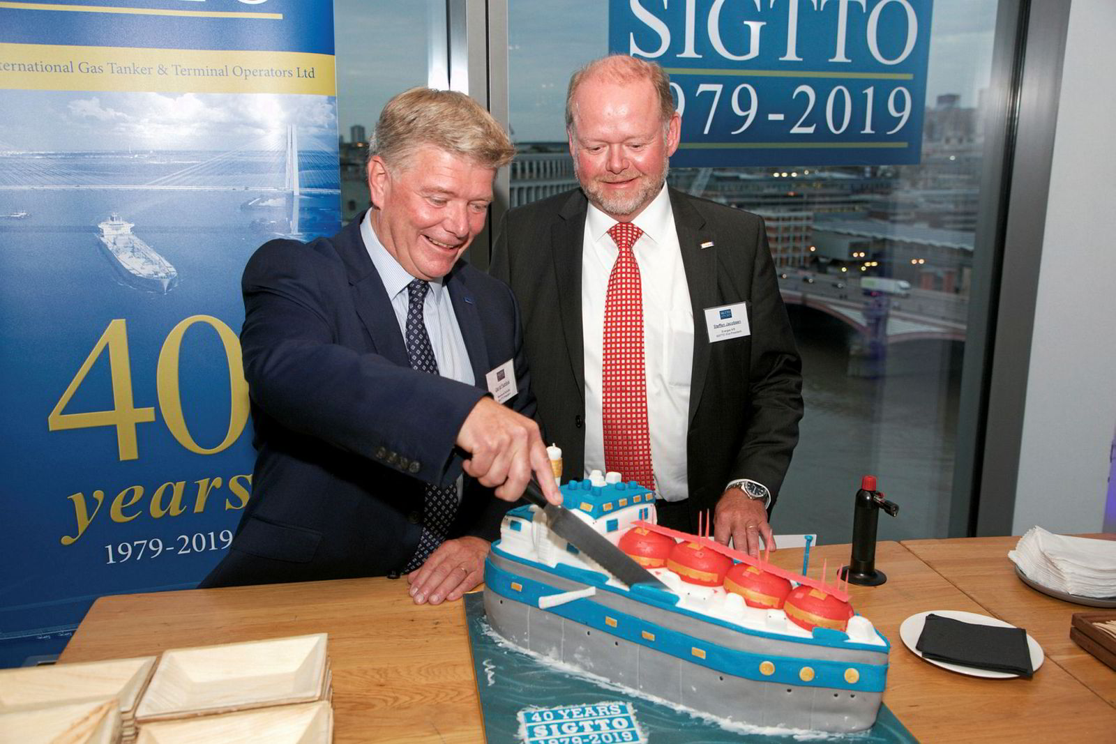 Sigtto pushes the cake out as it celebrates turning 40 | TradeWinds