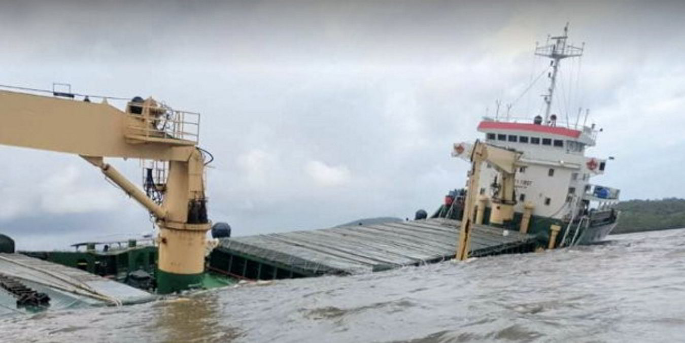 Crew rescued from partially capsized cargo ship that grounded off ...
